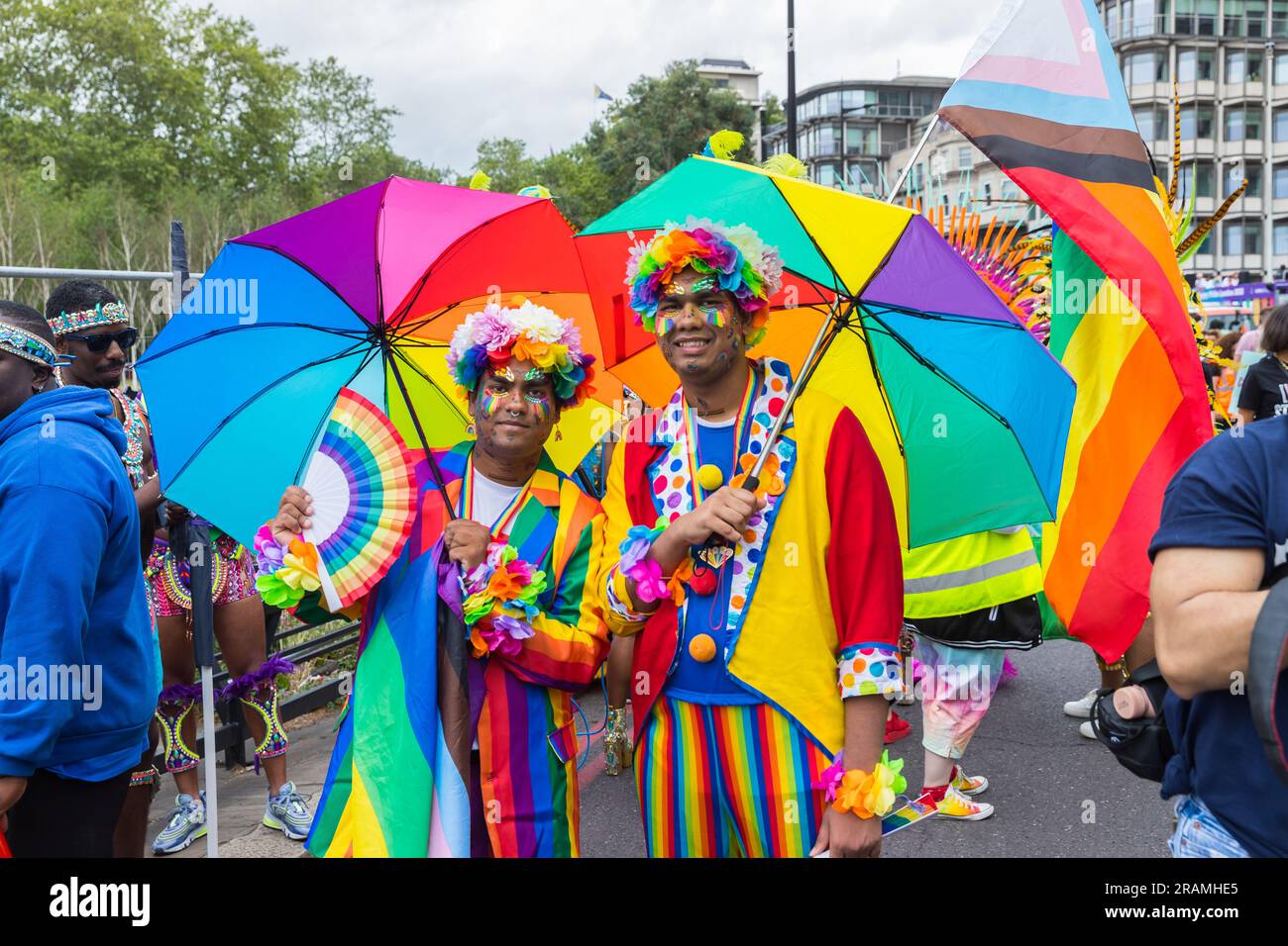 South Asian men in rainbow colours taking part in the Pride in London ...