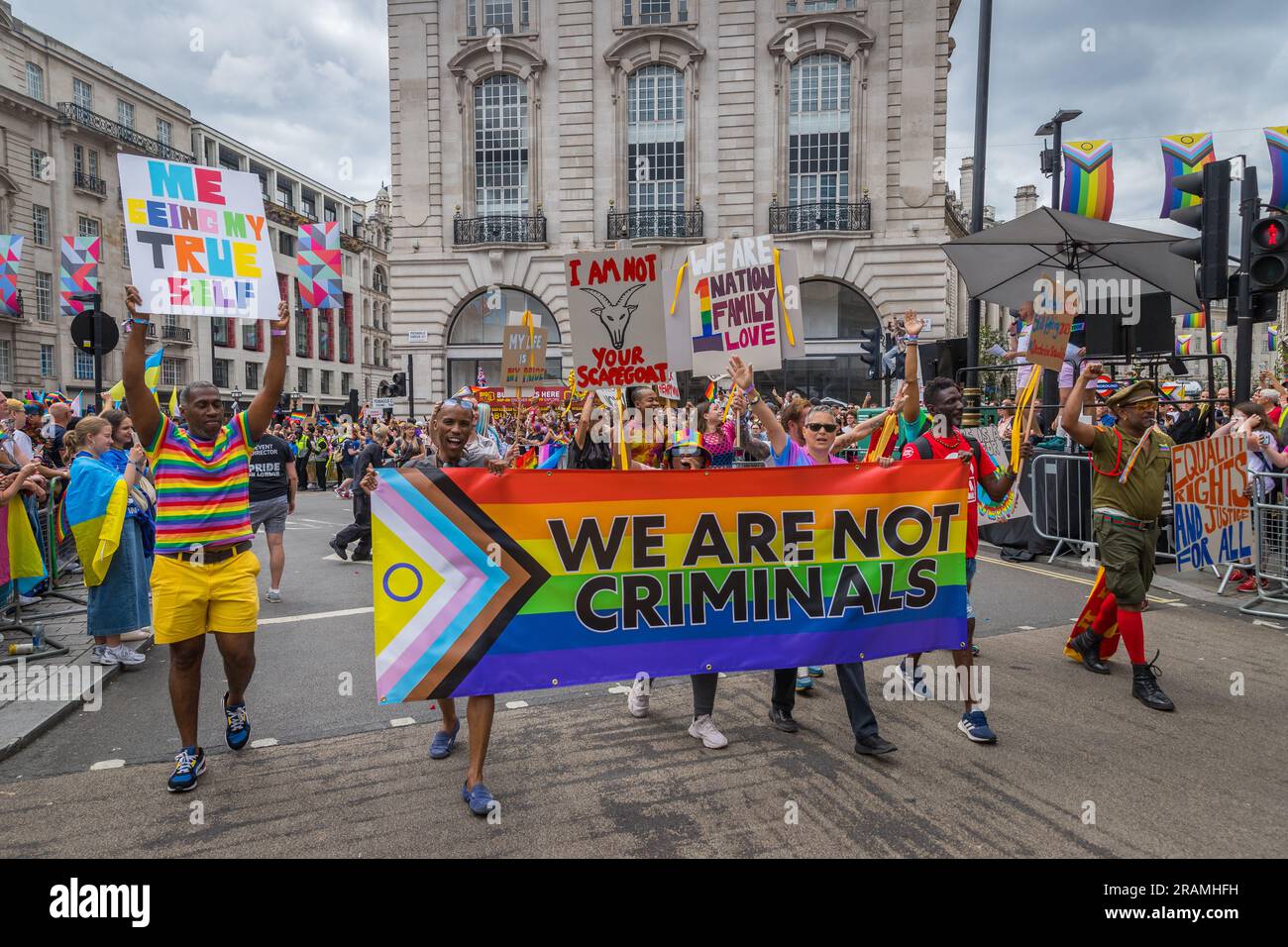 Progress flag stating "we are not criminals" during the Pride in London ...
