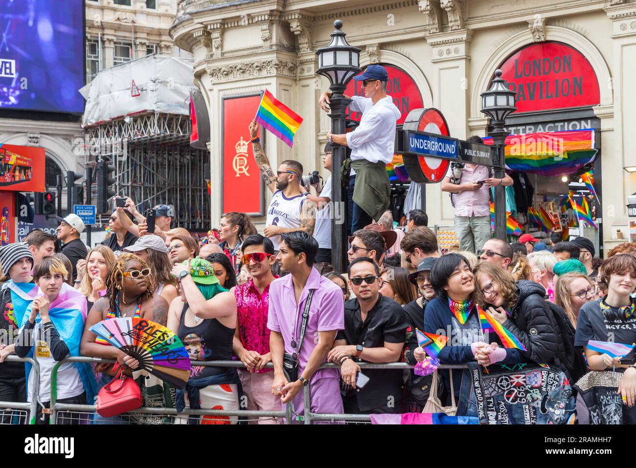 Spectators watching the Pride in London parade in Piccadilly Circus ...