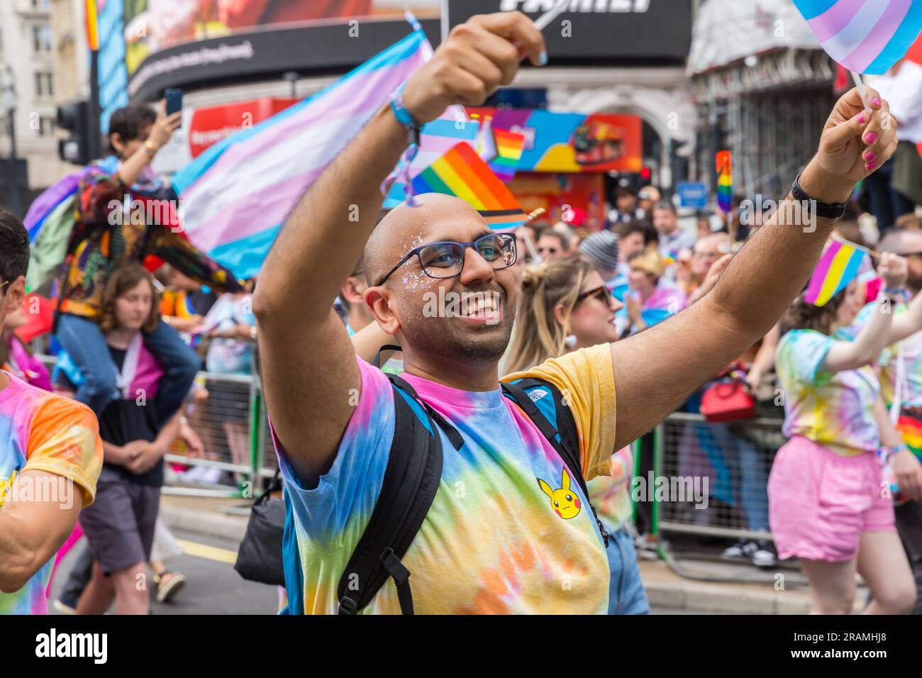 Smiling south asian man taking part in the Pride in London parade Stock ...