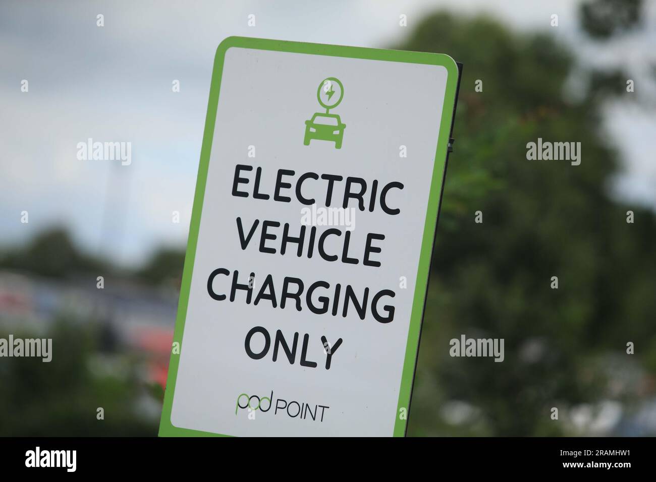 Electric vehicle charging only sign in a public car park Stock Photo ...