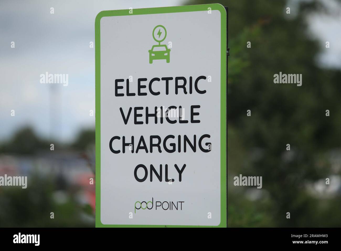 Electric vehicle charging only sign in a public car park Stock Photo ...