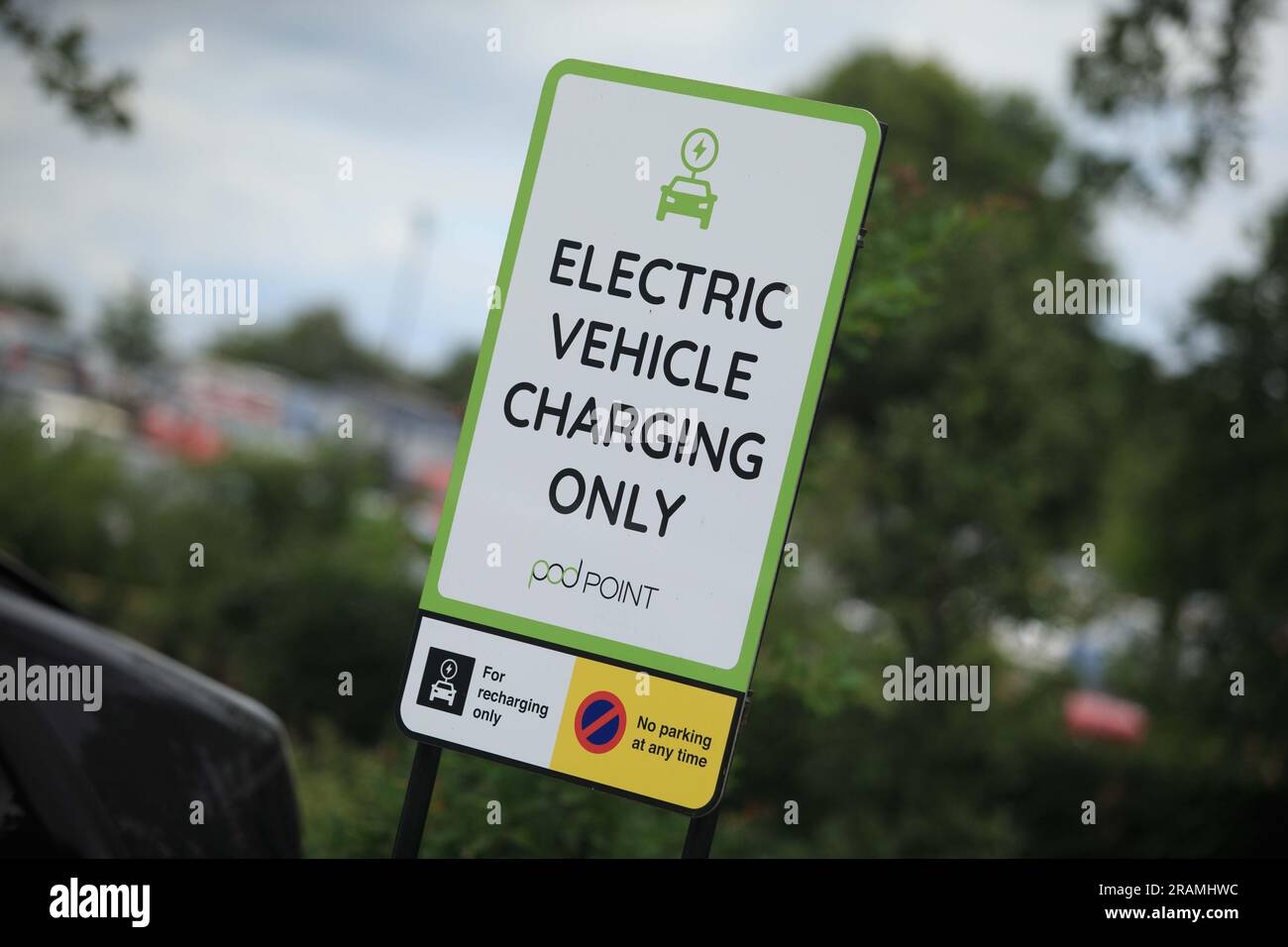 Electric vehicle charging only sign in a public car park Stock Photo ...