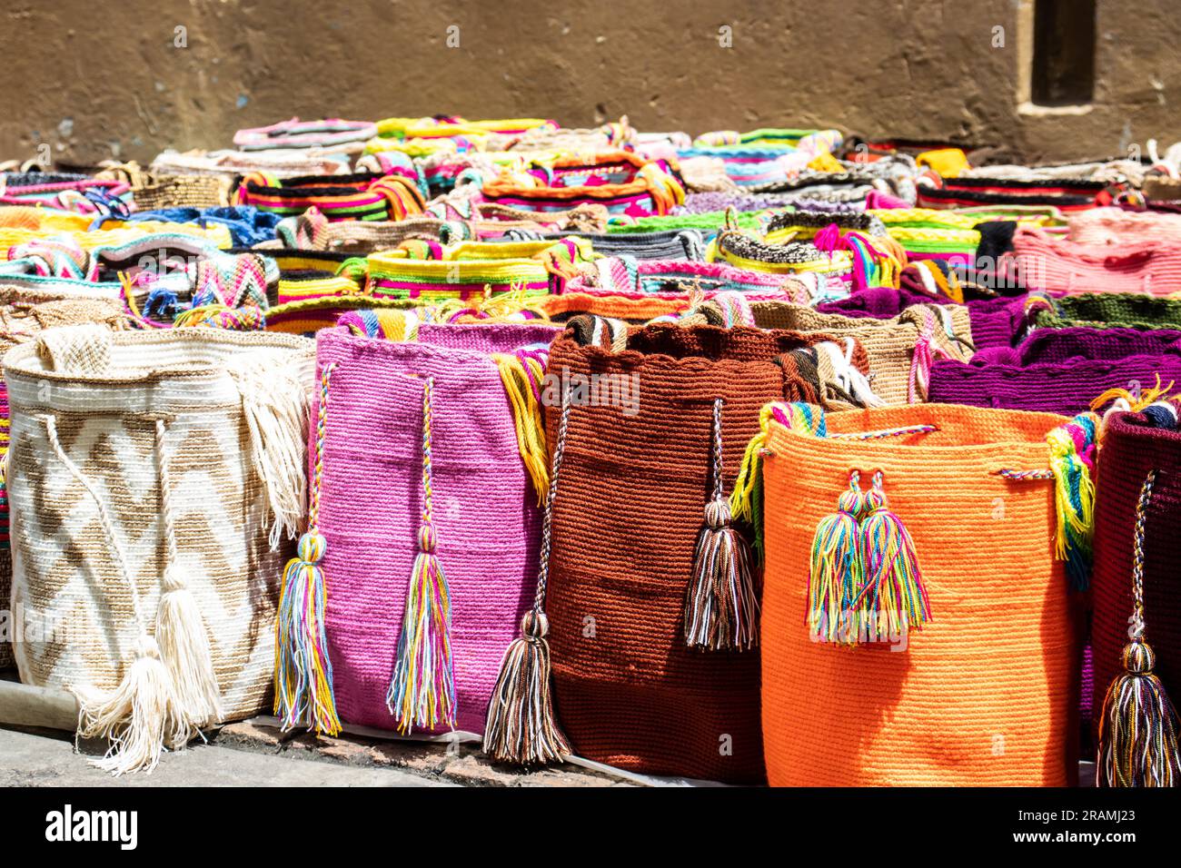 Street selling in Bogota of traditional bags hand knitted by women of ...