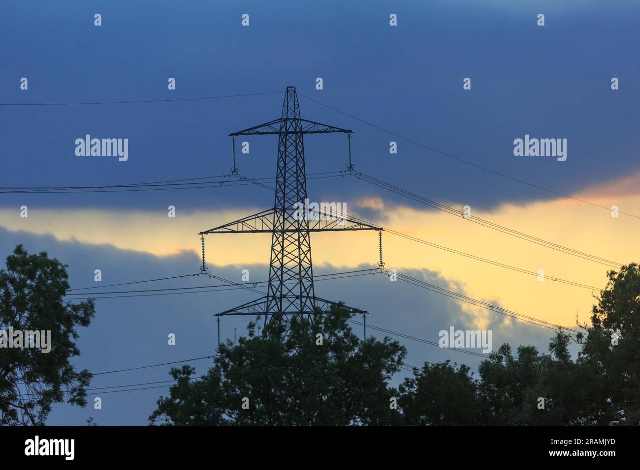 Sunset behind a electric pylon Stock Photo - Alamy