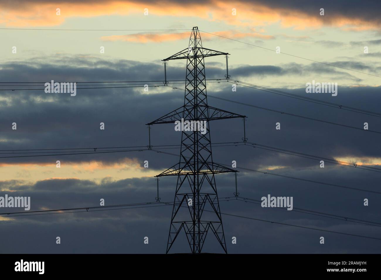 Sunset behind a electric pylon Stock Photo - Alamy
