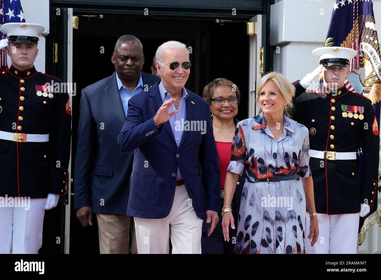 President Joe Biden and first lady Jill Biden, followed by Defense ...