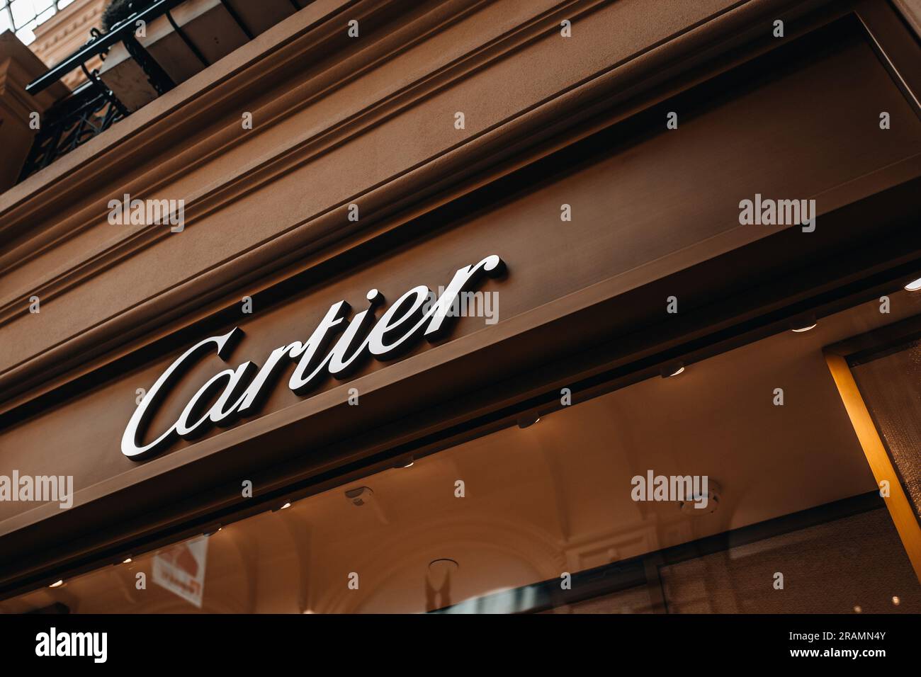 Golden logo Cartier at facade entrance to boutique fine jewelry watches ...