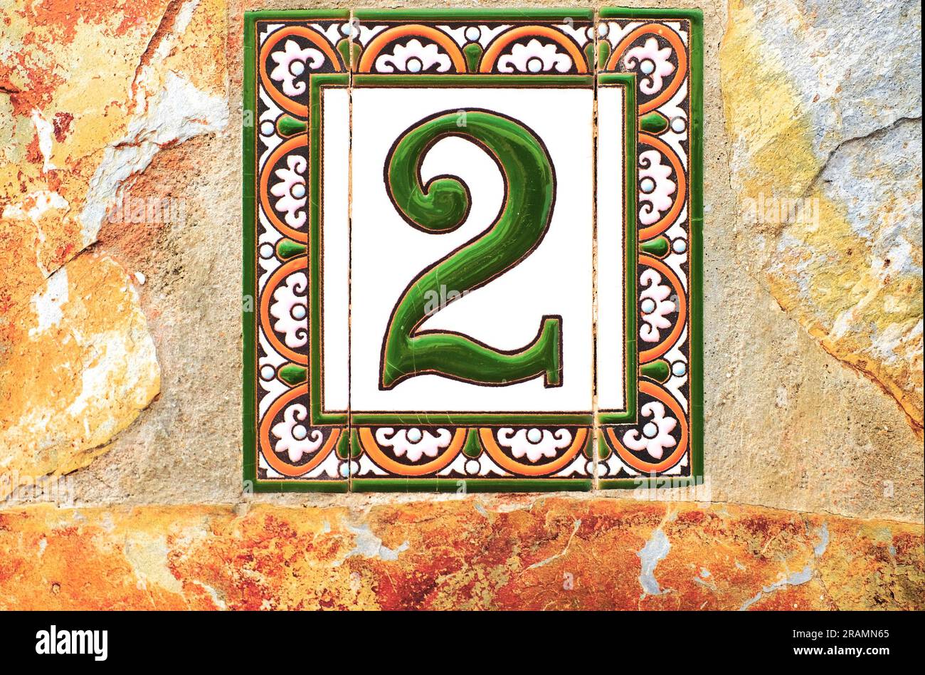 Number 2, two, decorative tile digit on a stone wall Stock Photo - Alamy