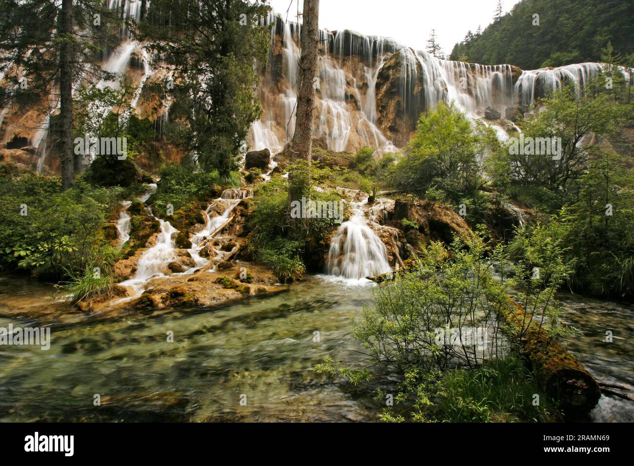 Water flows over Pearl Shoal Waterfall in Jiuzhaigou National Park in ...