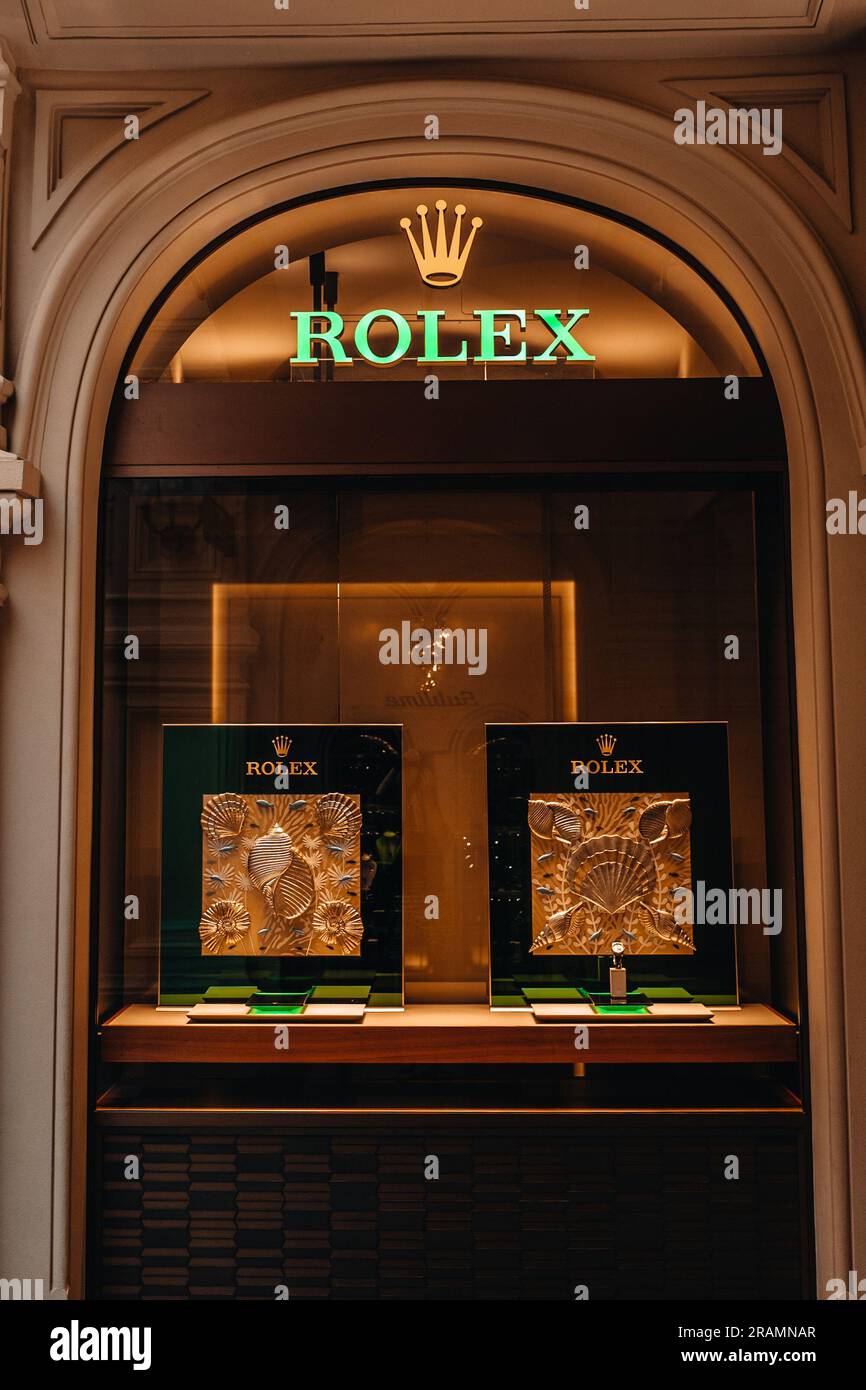 Vertical advertising of Rolex watches in the window of a watch store in ...