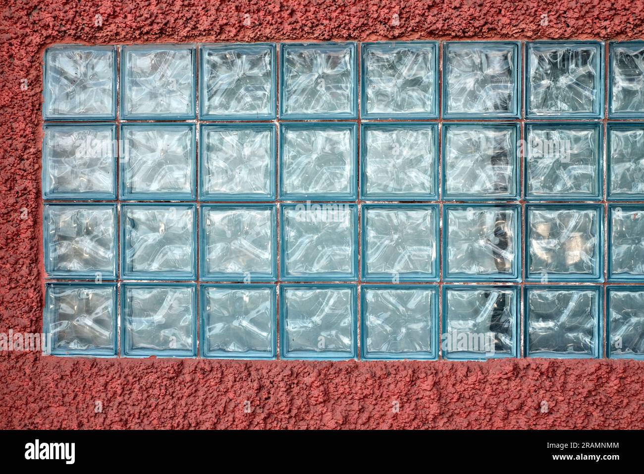 Architecture detail of a wall with blue tinted glass bricks (glass ...