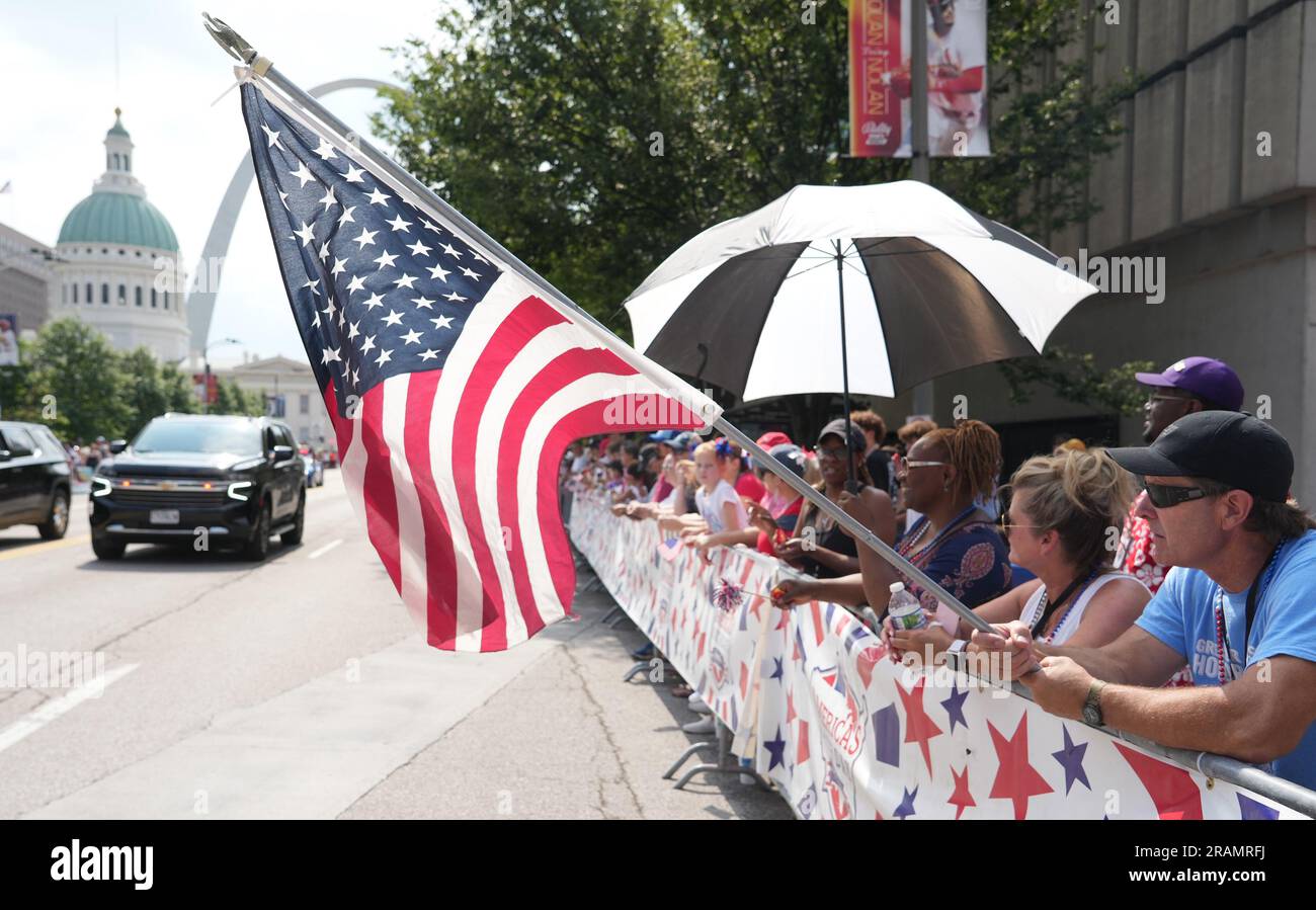 St. Louis, United States. 04th July, 2023. A parade goer waves an ...