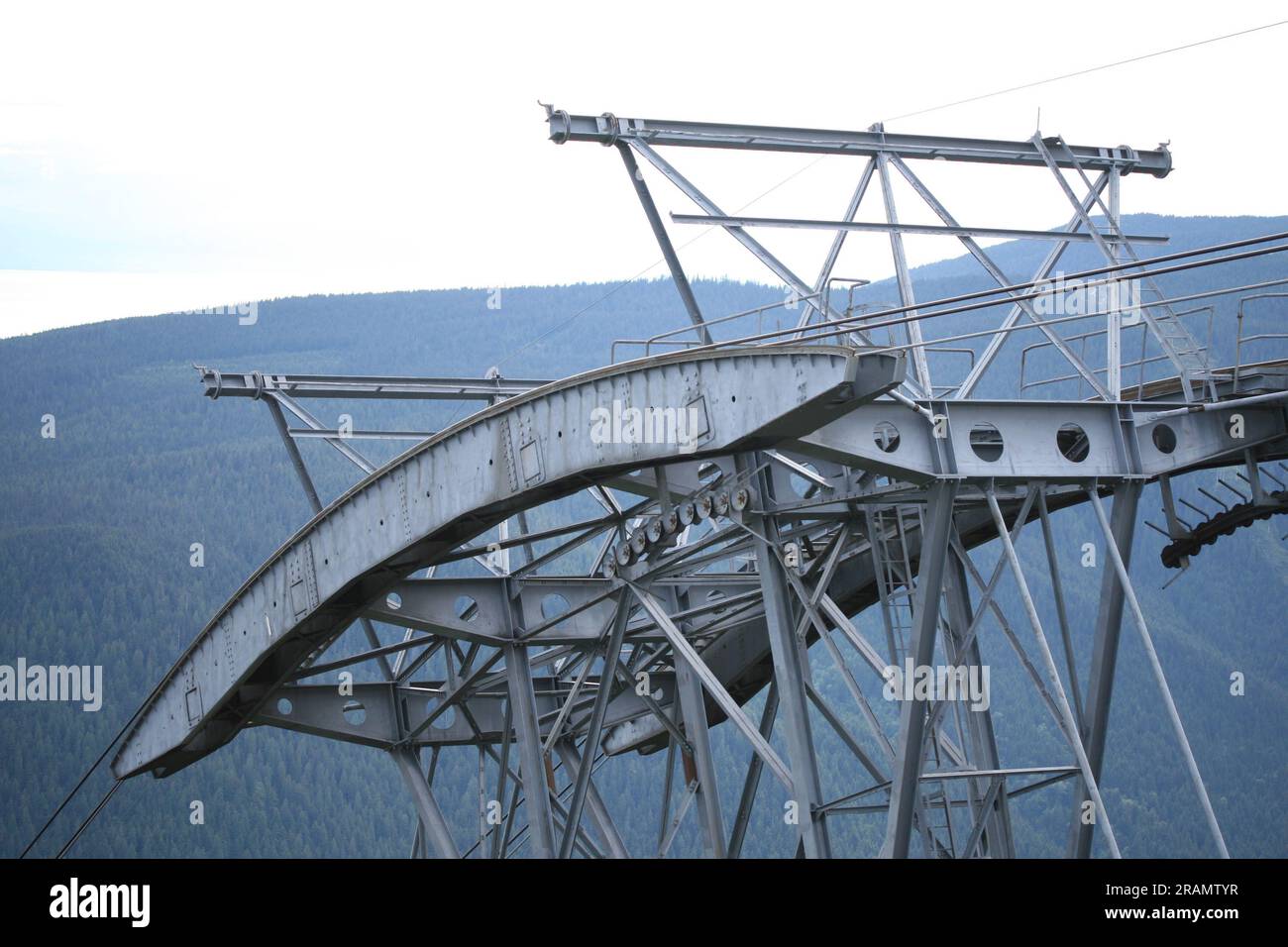 Gondola tower top on Grouse Mountain with view of surrounding mountains ...