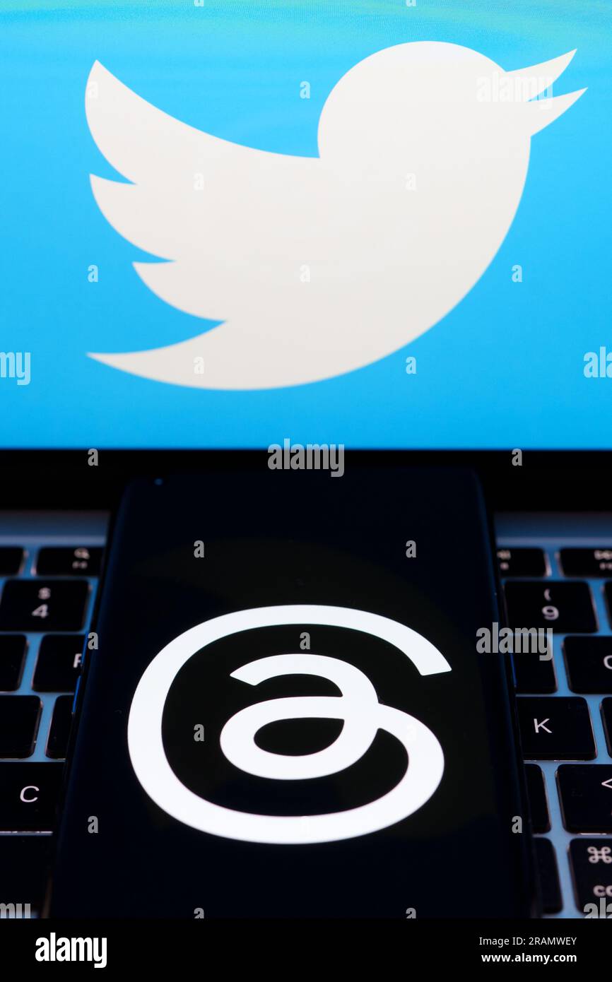 Threads vs Twitter concept. Threads app logo seen on screen of ...