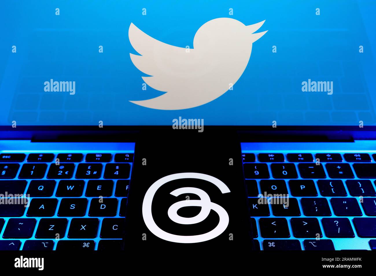 Threads vs Twitter concept. Threads app logo seen on screen of ...