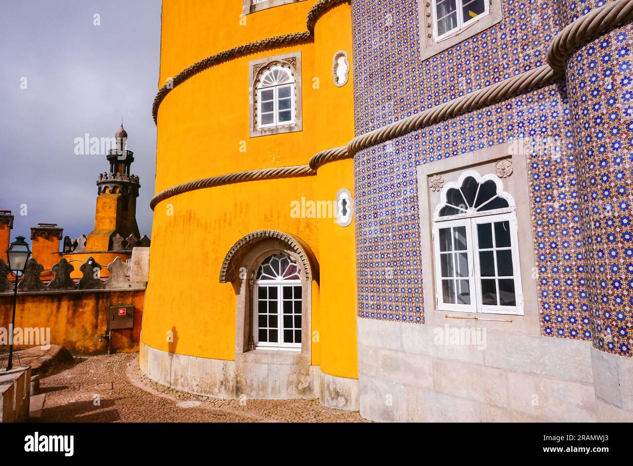 Geometric Moorish patterned tiles decorate the facade at the front ...