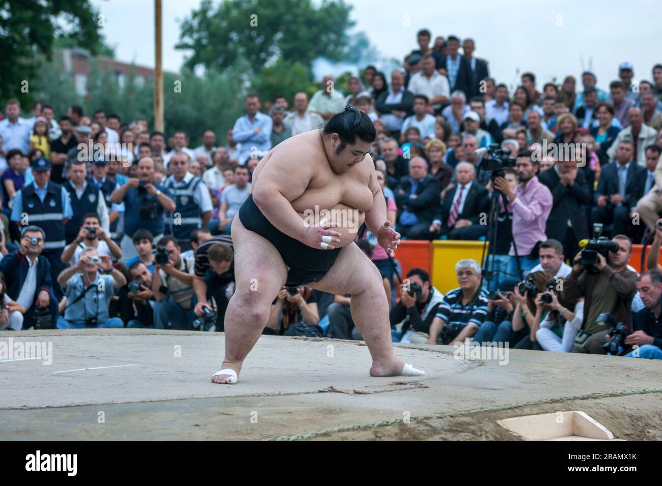 A Japanese Sumo wrestler prepares himself for battle before an ...