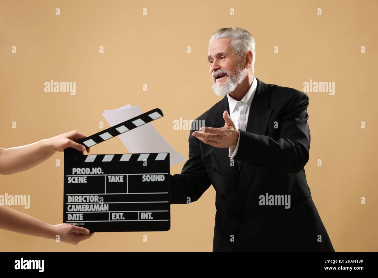 Senior actor performing role while second assistant camera holding ...