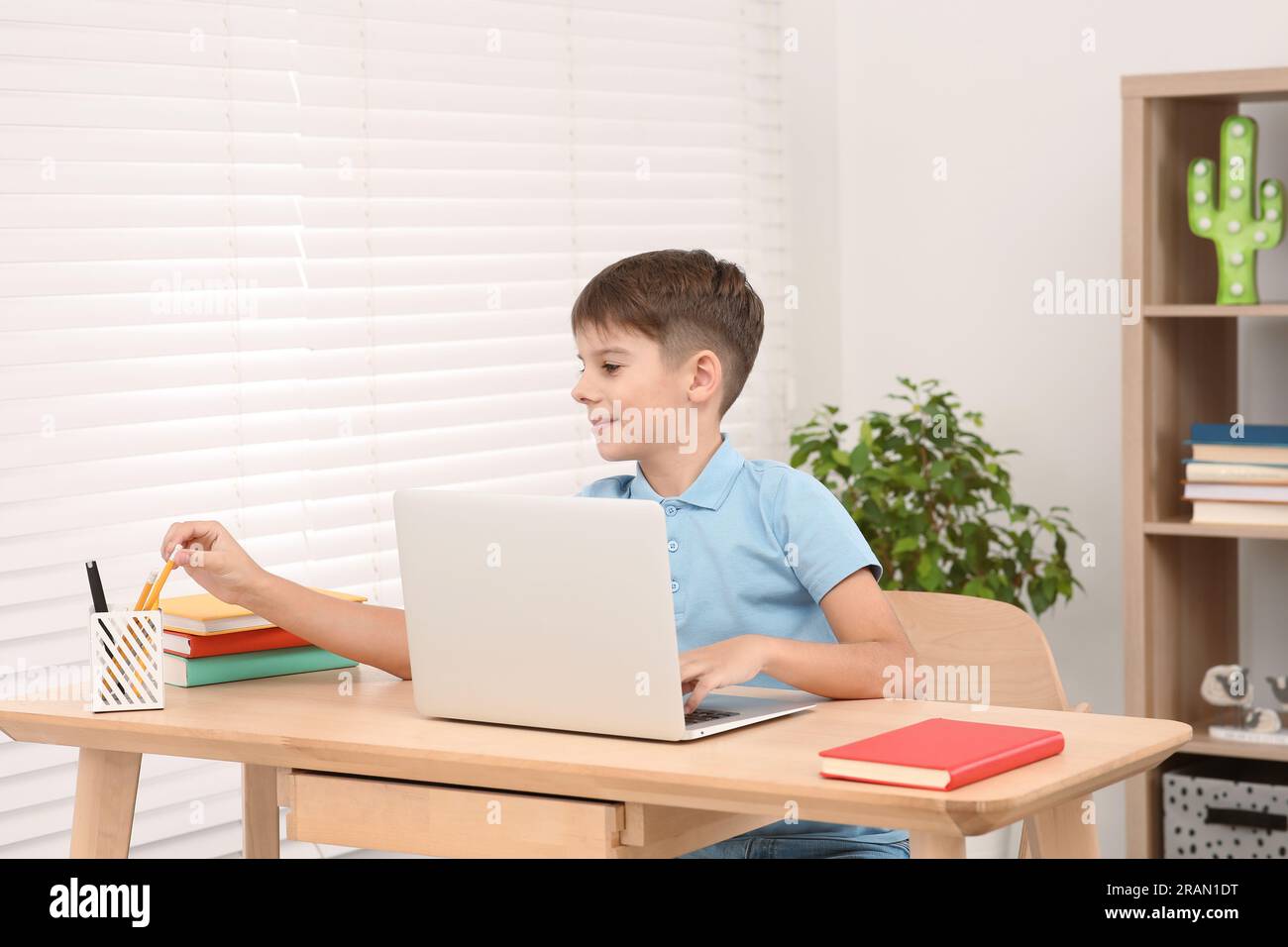 Preteen boy using computer studying hi-res stock photography and images ...