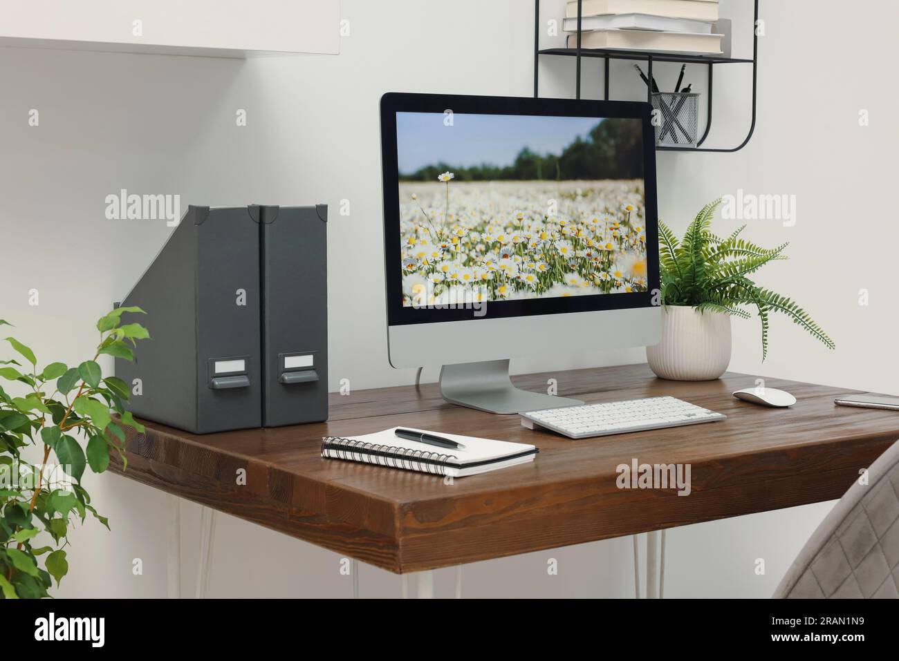 Cozy workspace with computer on wooden desk at home Stock Photo - Alamy