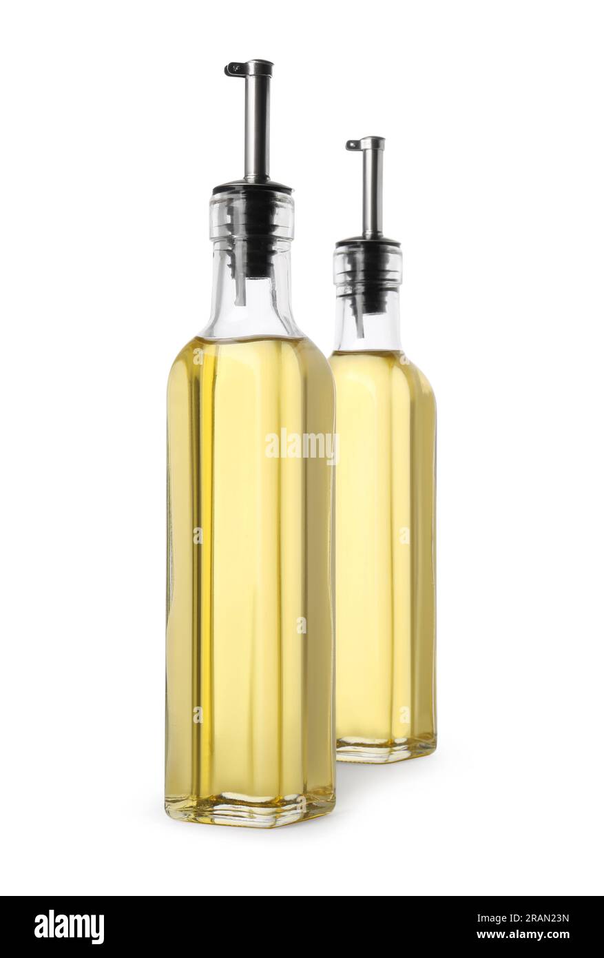 Glass bottles of cooking oil on white background Stock Photo - Alamy