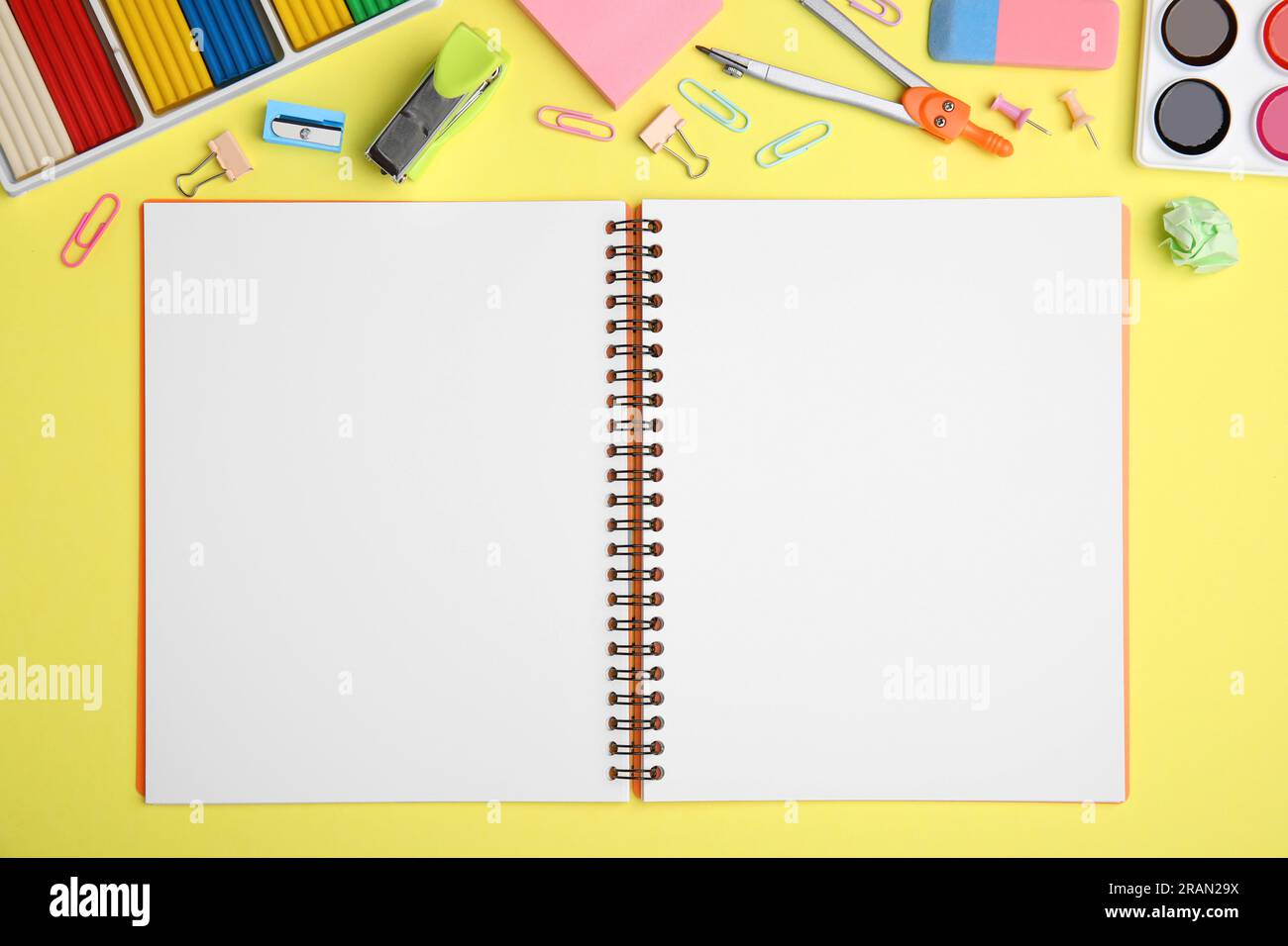 Flat lay composition with notebook and different school stationery on ...
