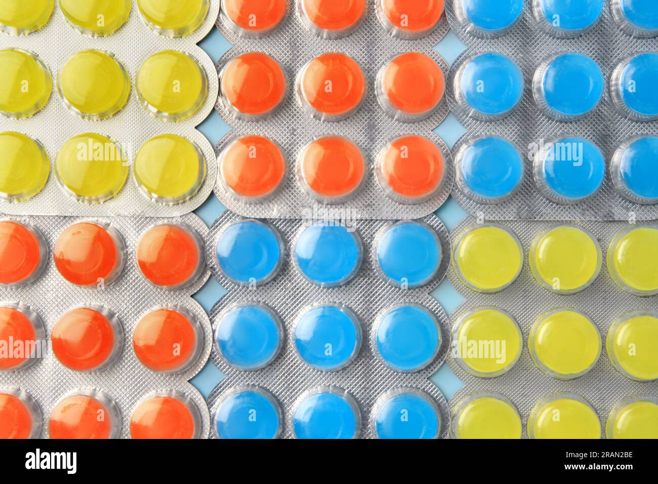 Blisters with cough drops on light blue background, flat lay Stock ...