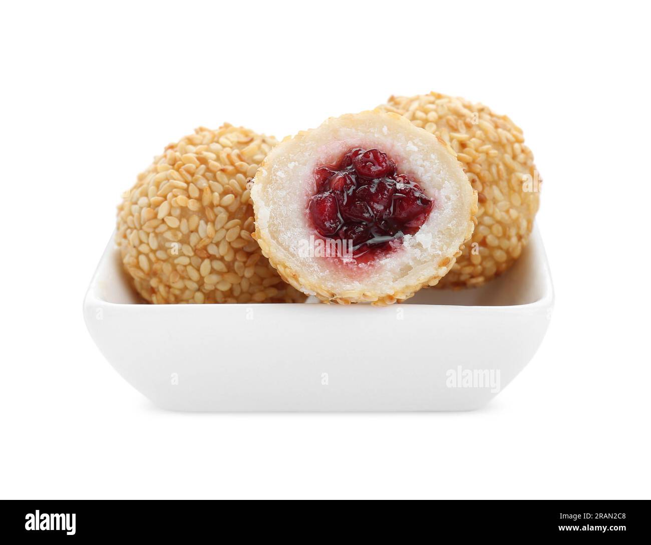 Bowl of delicious sesame balls with red bean paste on white background ...