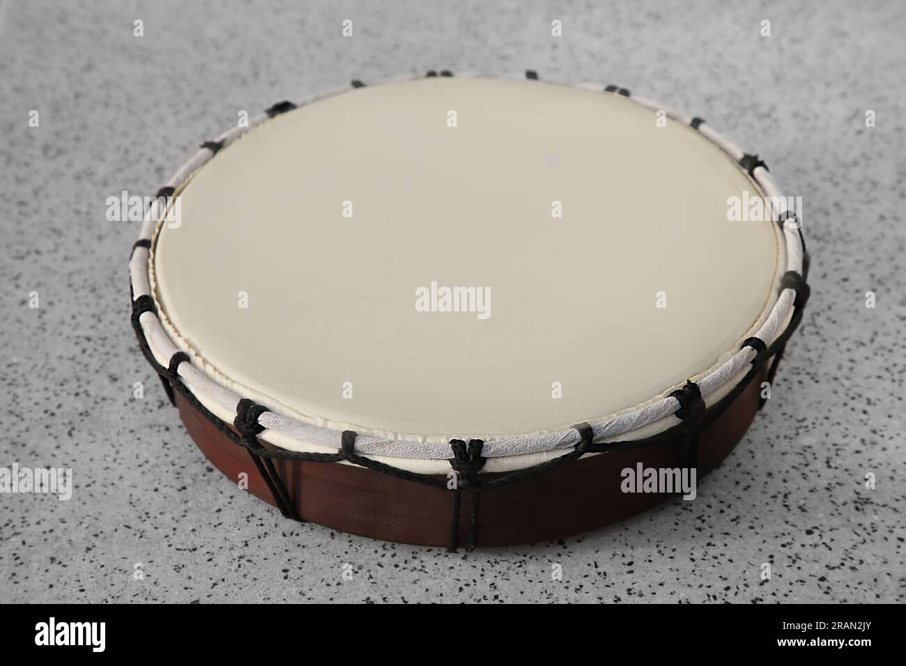 Drum on grey table, closeup. Percussion musical instrument Stock Photo ...