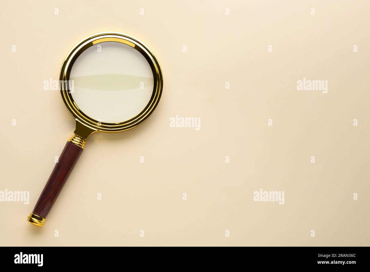 Magnifying glass on beige background, top view. Space for text Stock ...