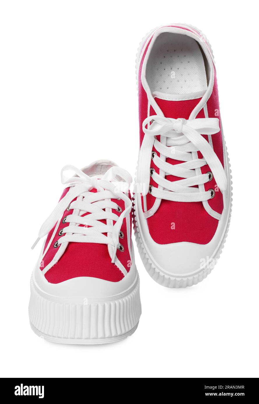 Pair of red classic old school sneakers on white background Stock Photo ...