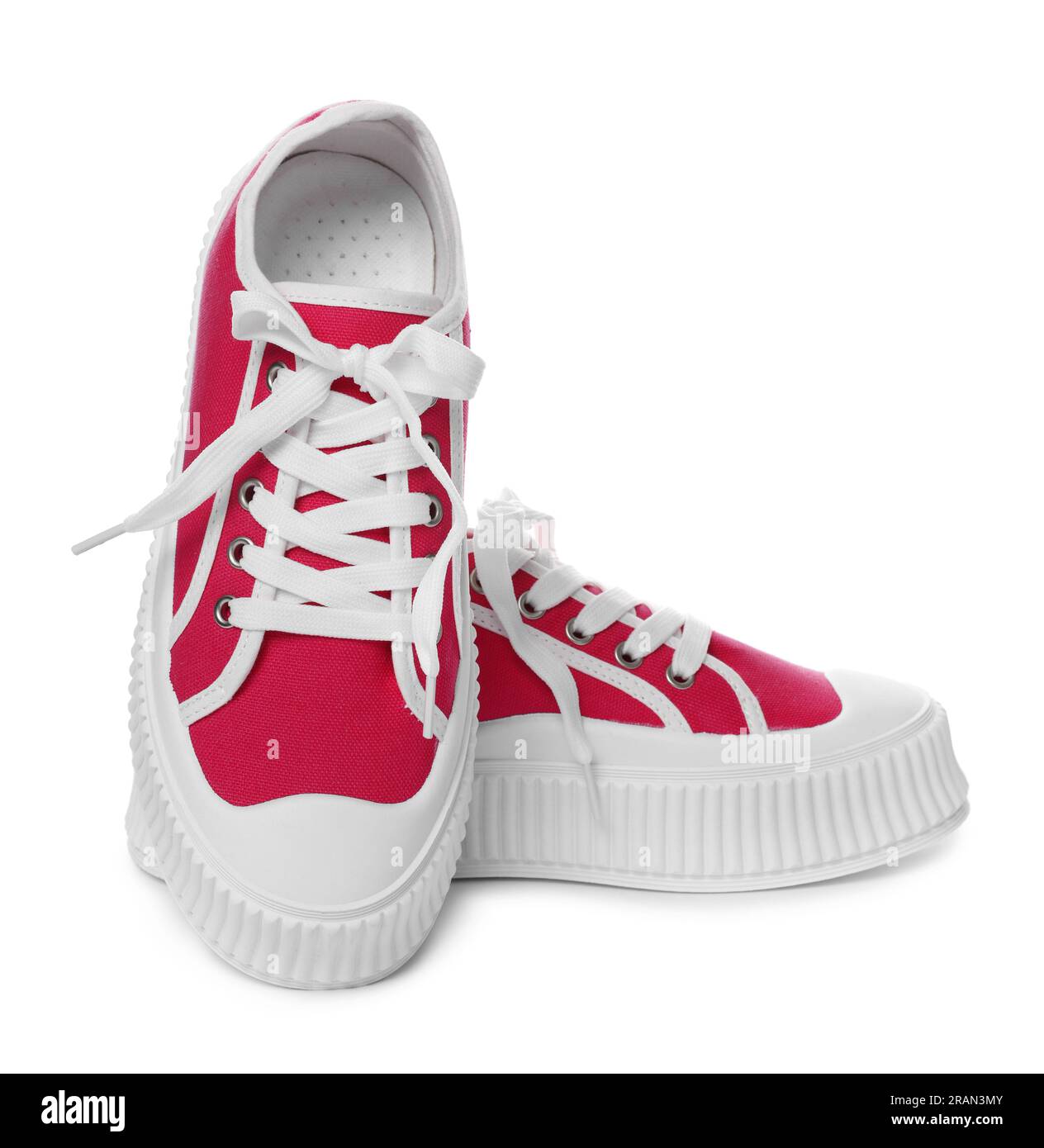 Pair of red classic old school sneakers on white background Stock Photo ...