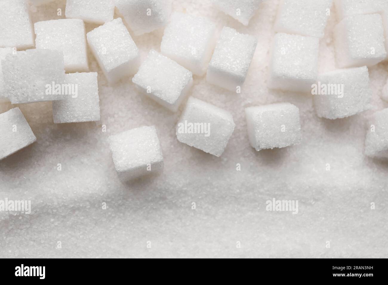 Different types of white sugar as background, top view Stock Photo - Alamy