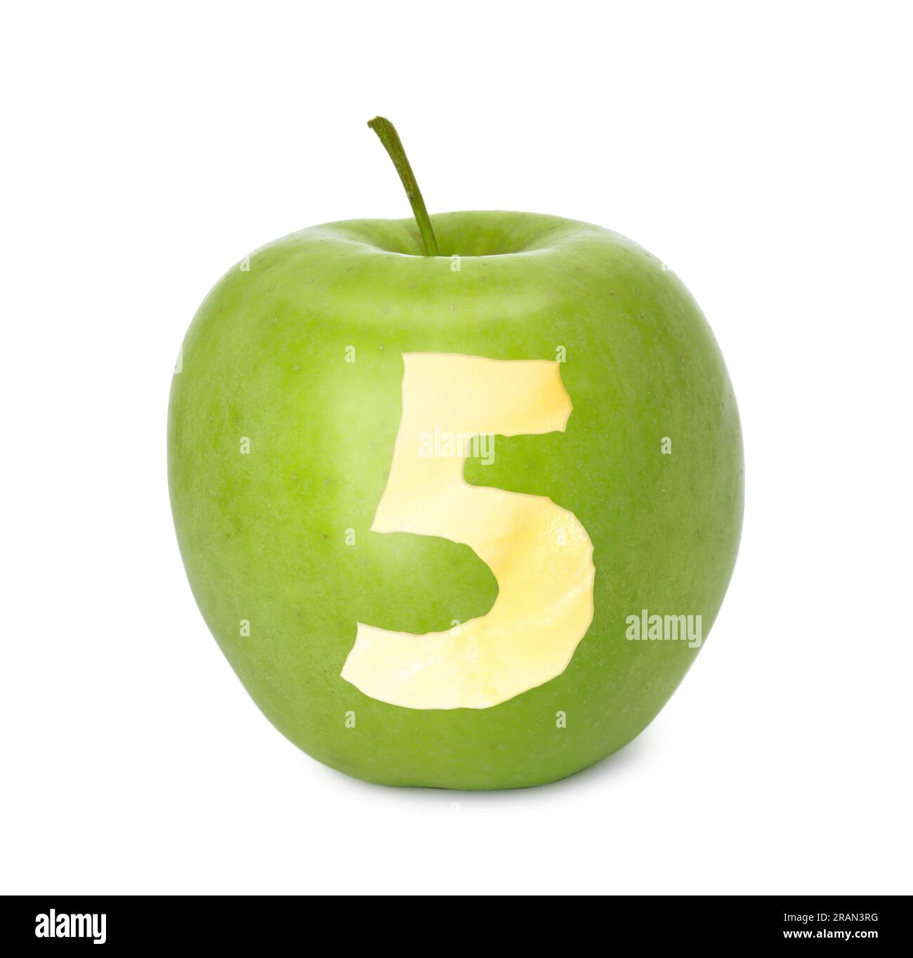Green apple with carved number five as school grade on white background ...