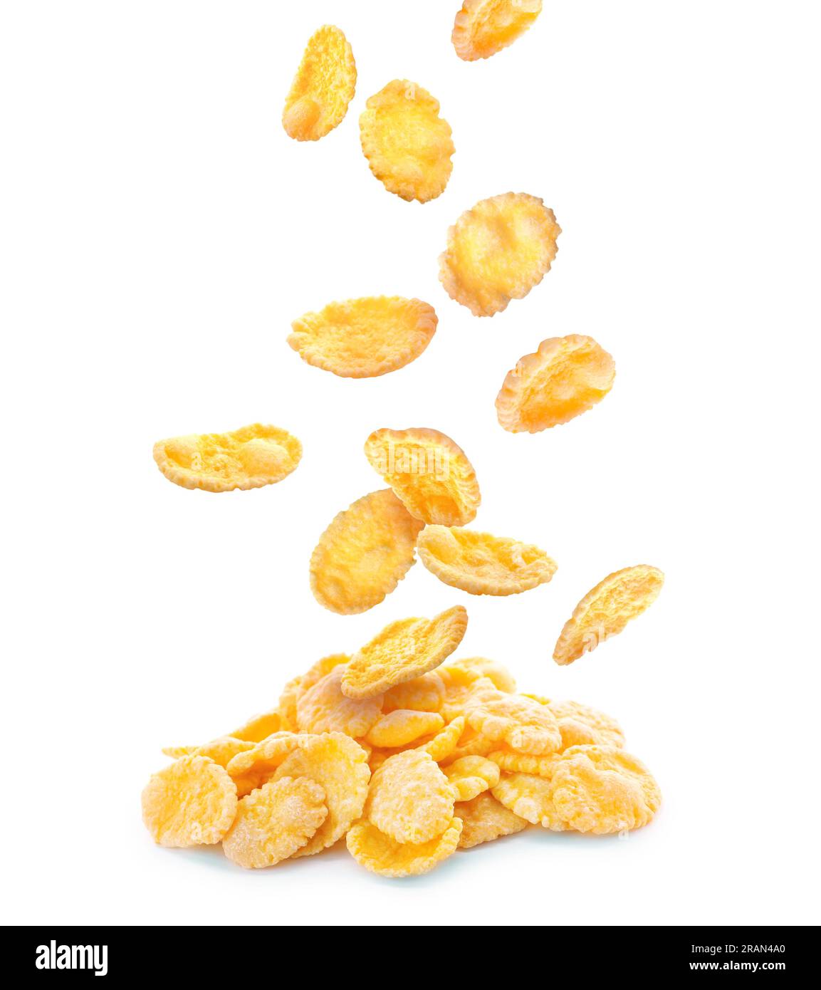 Golden corn flakes falling on white background Stock Photo - Alamy