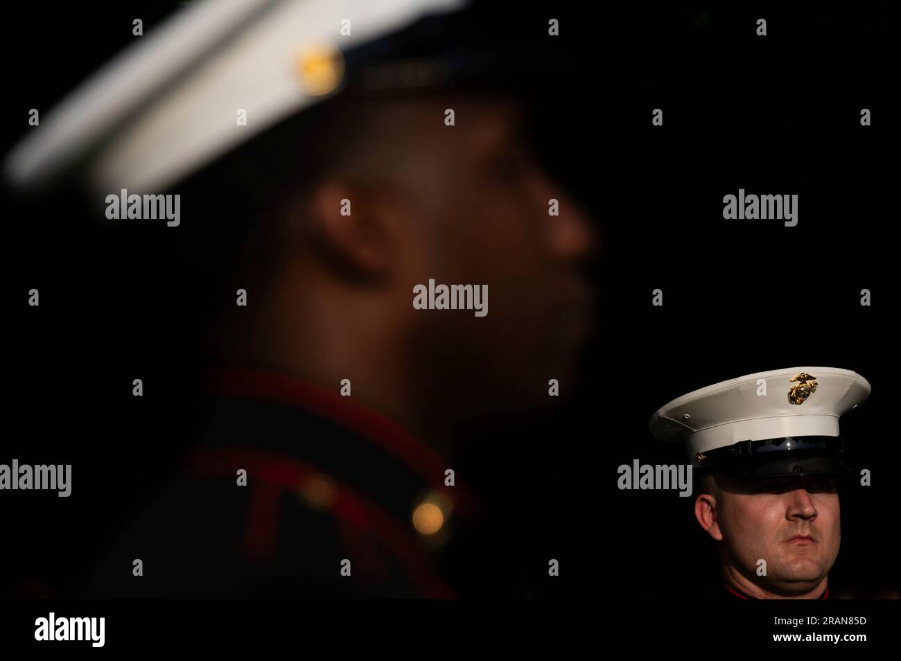 United States Marine Corps Color Guards stand at attention before ...
