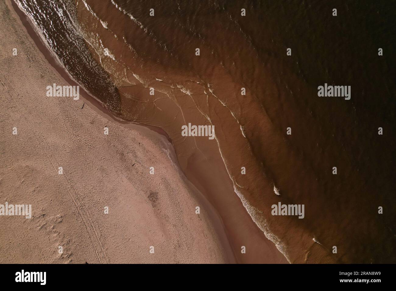 Drone aerial view of waves sea ocean coast. Beach and dunes dark calm ...