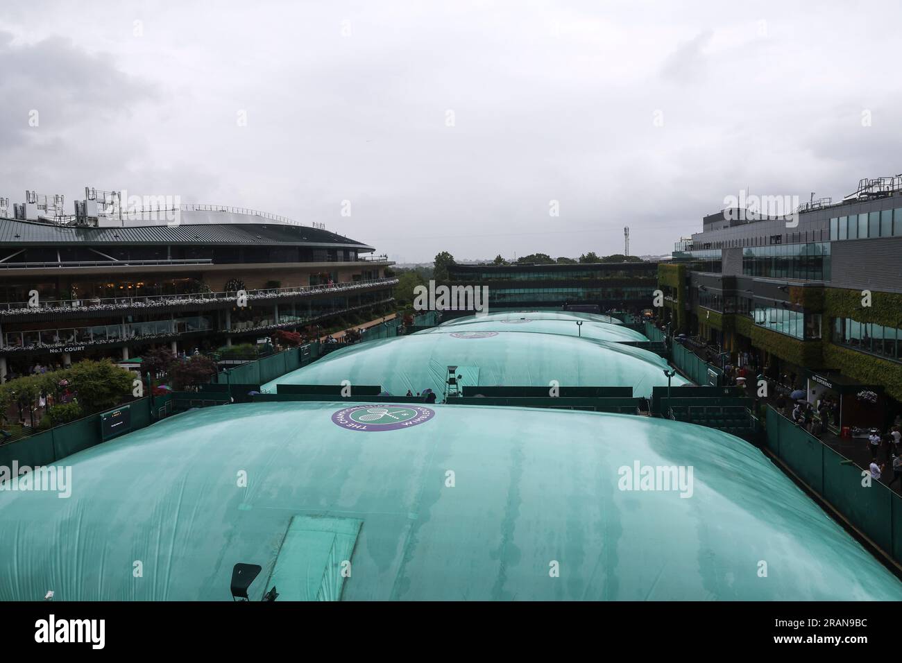London, Britain. 4th July, 2023. Courts are covered from rain during ...