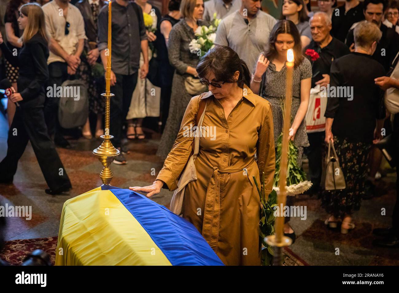 A woman pays tribute during the memorial service of Ukrainian writer ...