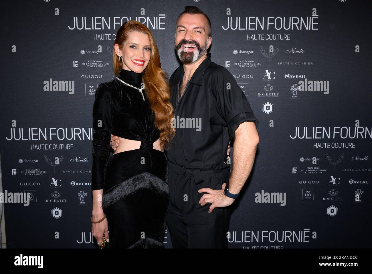 Paris, France. 04th July, 2023. A guest and Designer Julien Fournier ...