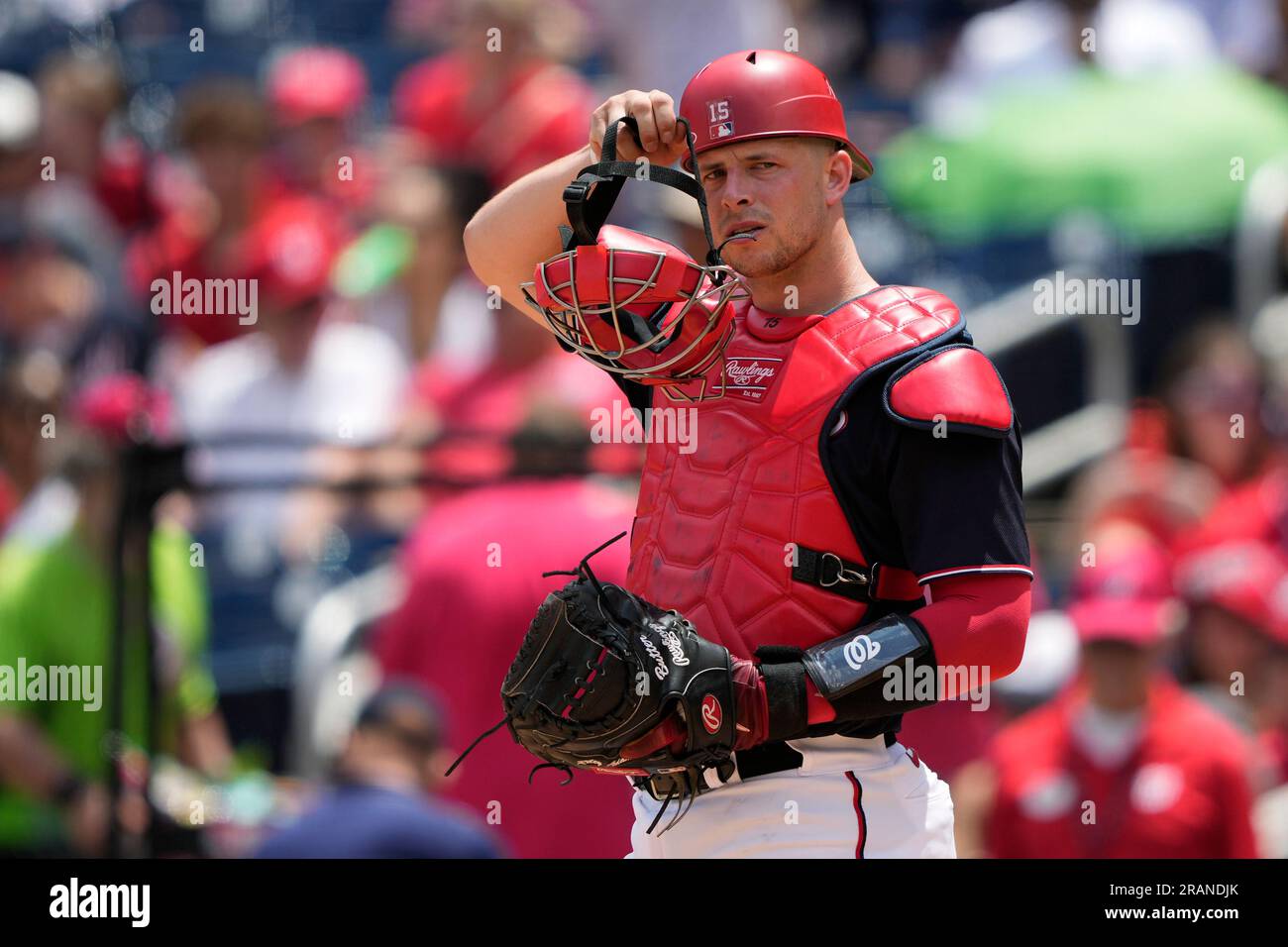 Washington Nationals catcher Riley Adams adjusts his mask during a ...