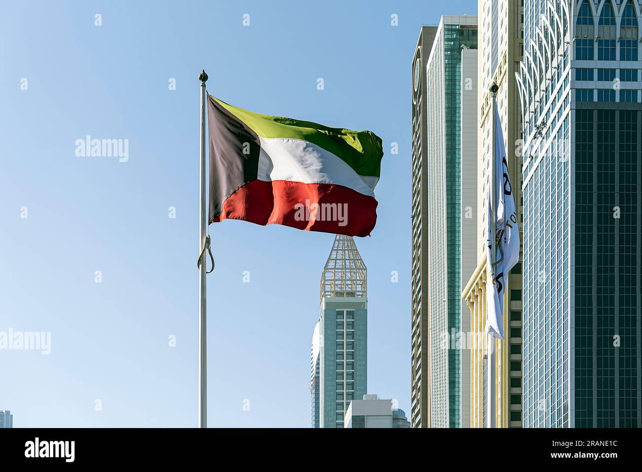 Flag waving on the background modern building, national symbol of ...