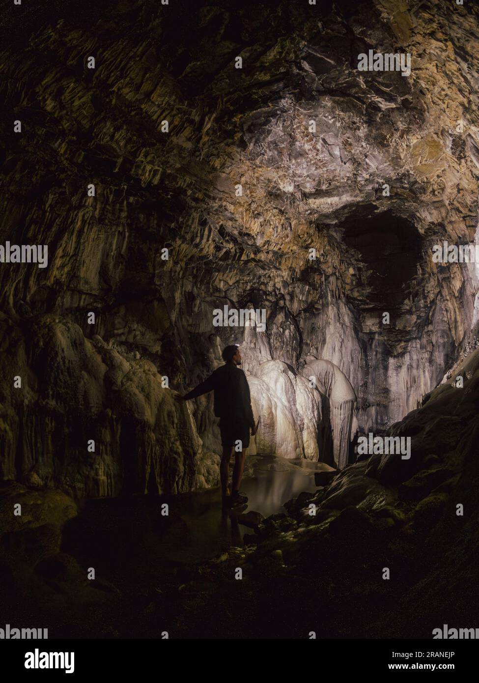 Man exploring the mysterious and natural beauty of Spar Cave on the ...