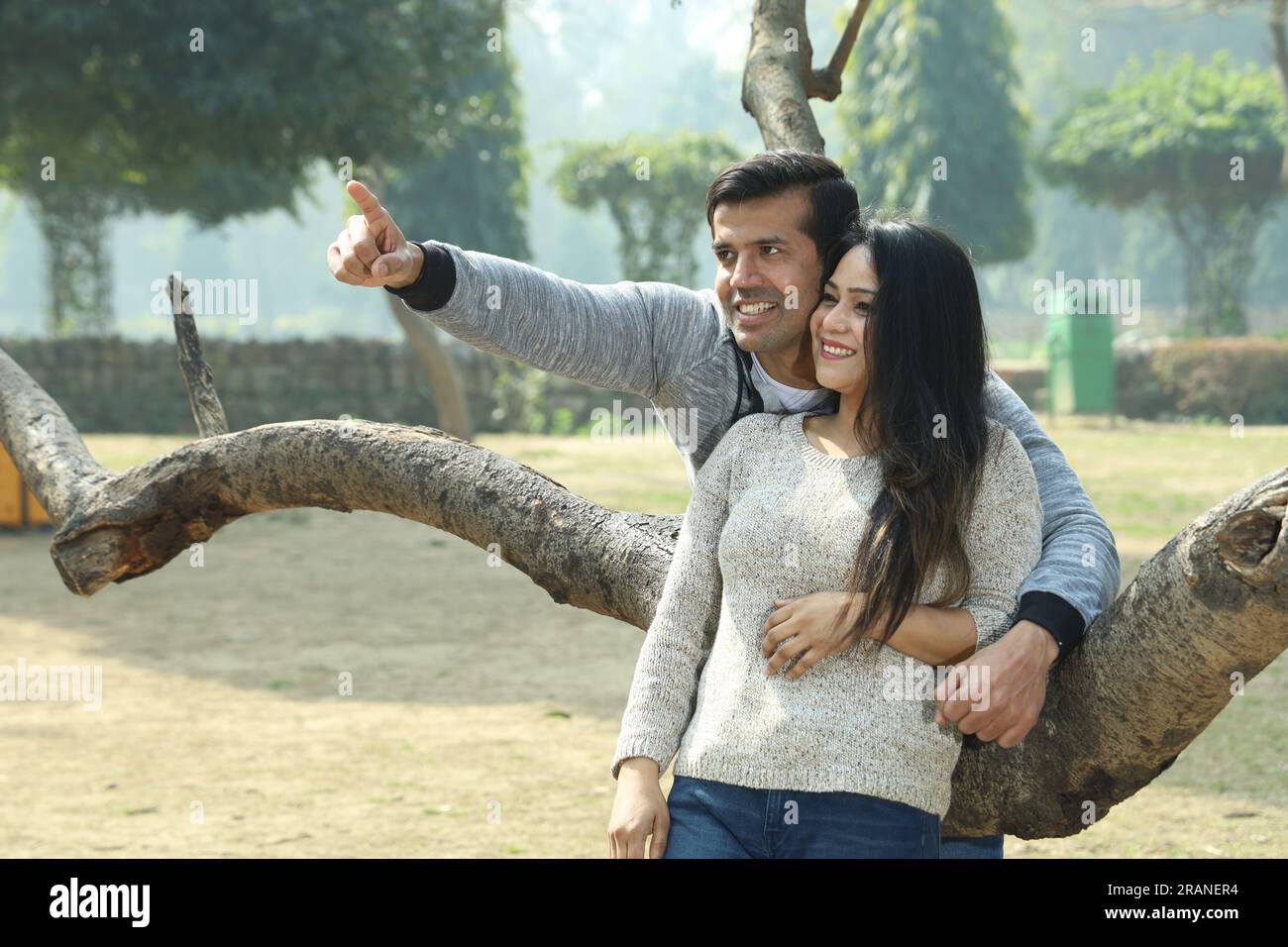 Beautiful Indian happy college students looking into the mobile phone ...