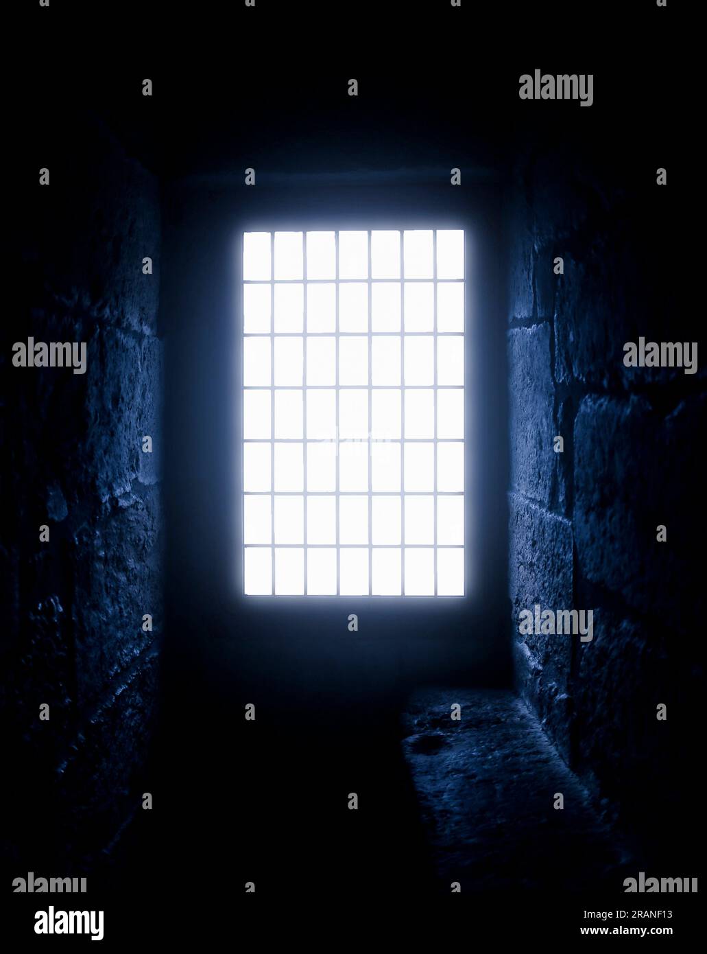 Rays of moonlight break through the narrow window of the old castle ...