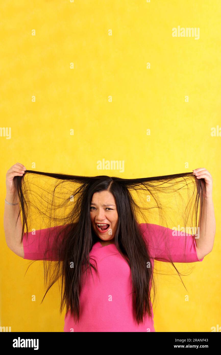 Adult 40 Year Old Latina Woman Ruffles Her Hair Desperate With Anxiety