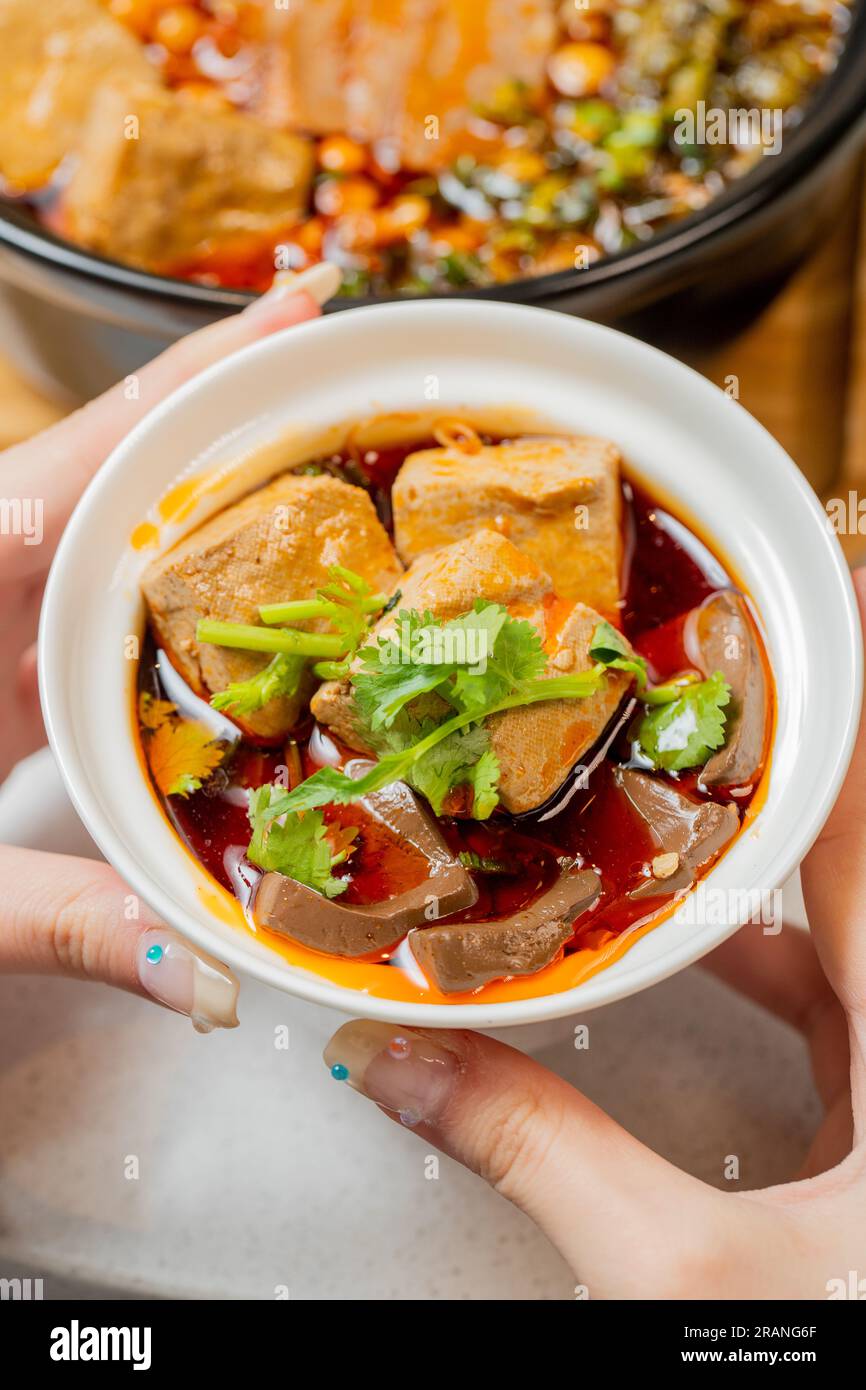 Delicious spicy duck blood jelly soup bowl and stinky tofu with ...