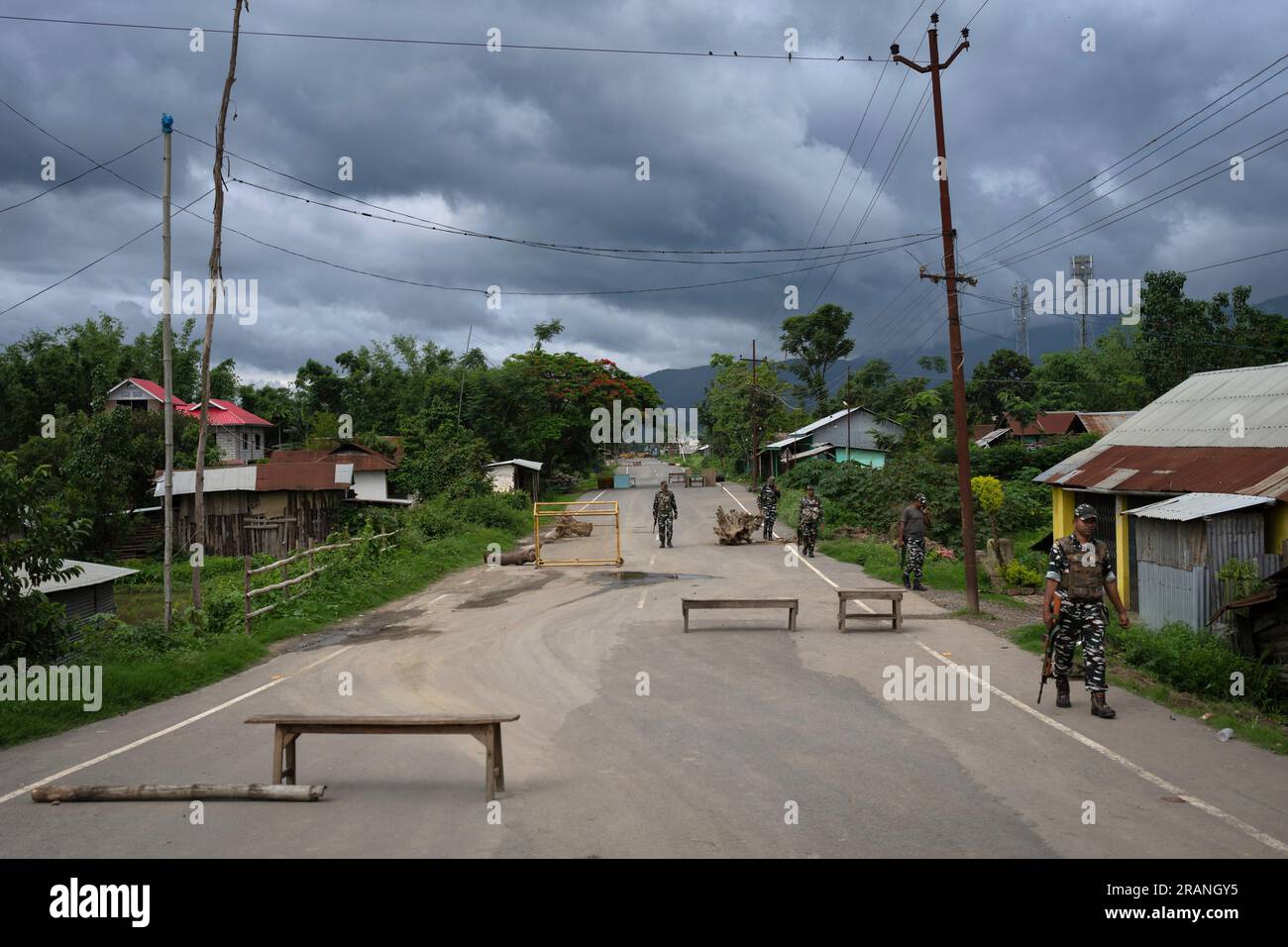 Indian paramilitary soldiers patrol a deserted street at a de facto ...
