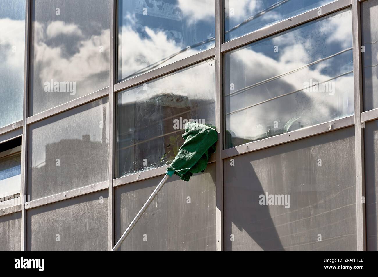 window washing, washing a street shop window Stock Photo - Alamy
